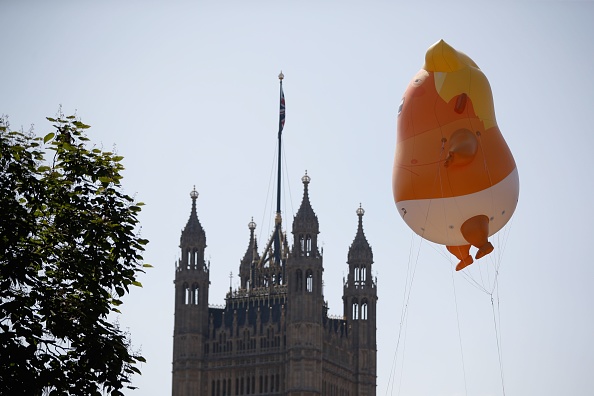 Trump Baby blimp flies outside Parliament as thousands of protesters ...